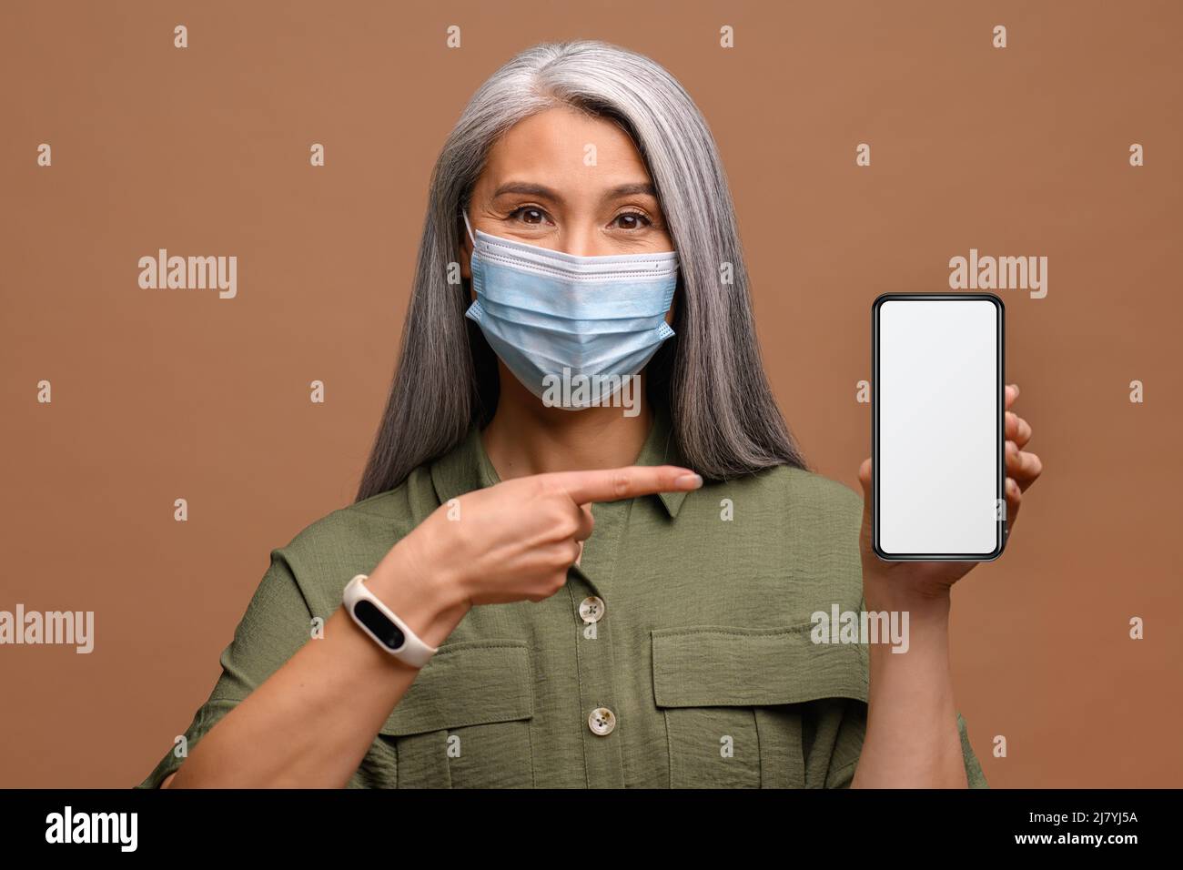 World pandemic, epidemic. Mature woman in medical mask with a ...