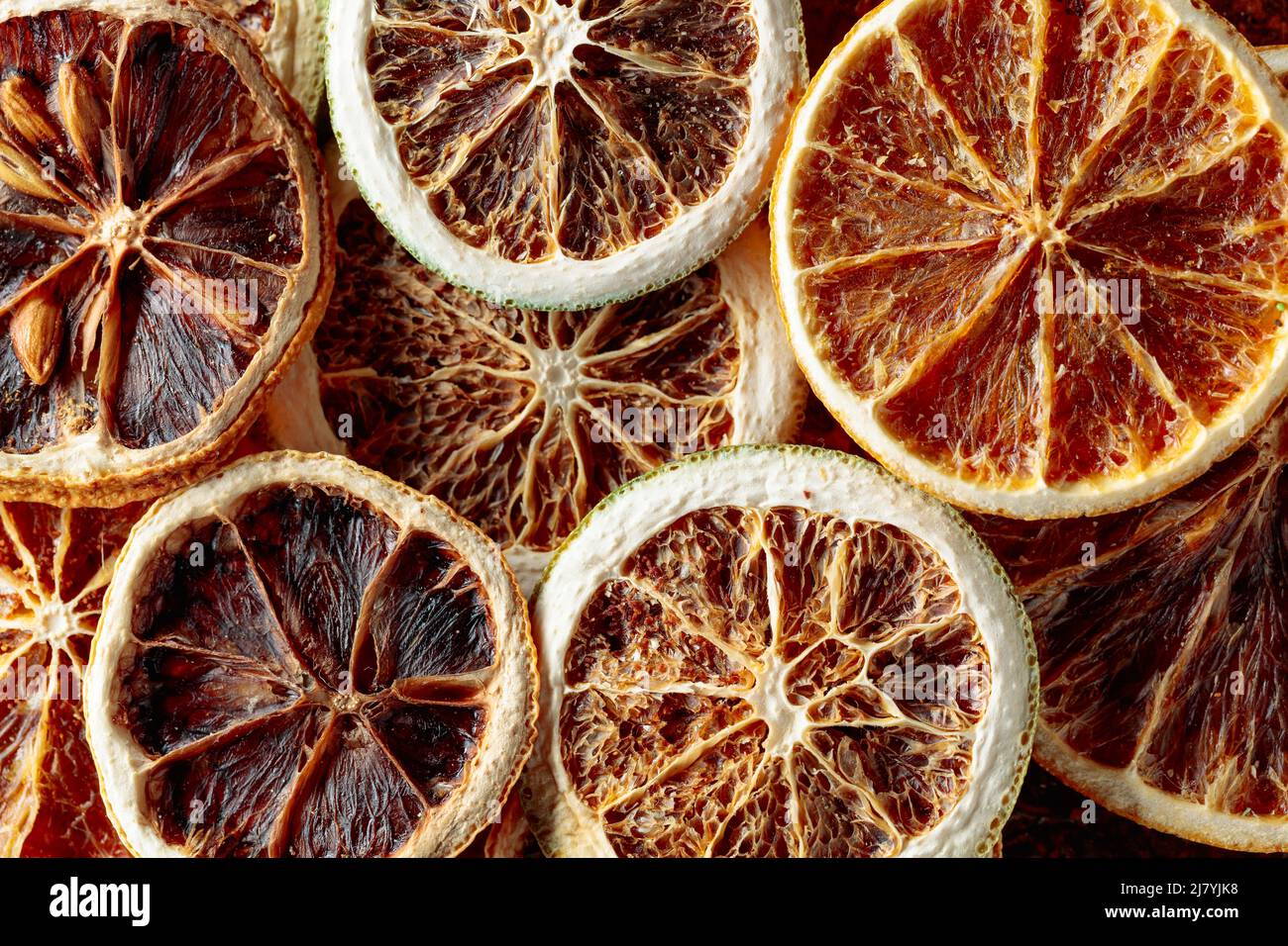 Dried orange slices background. Dehydrated crispy fruit slices. Pile of ...