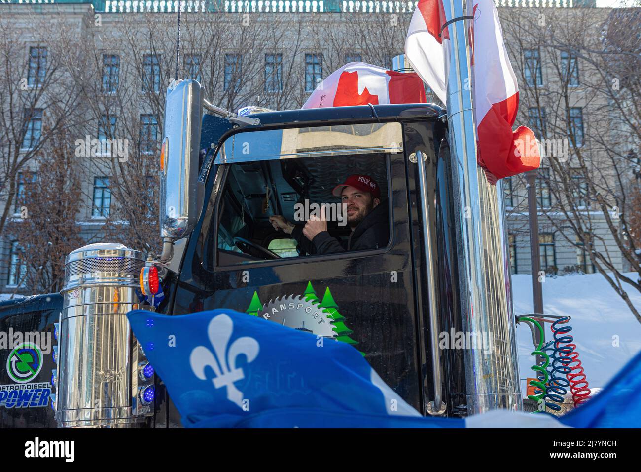 A trucker blows the horn of his truck at the "convoie de la liberte ...