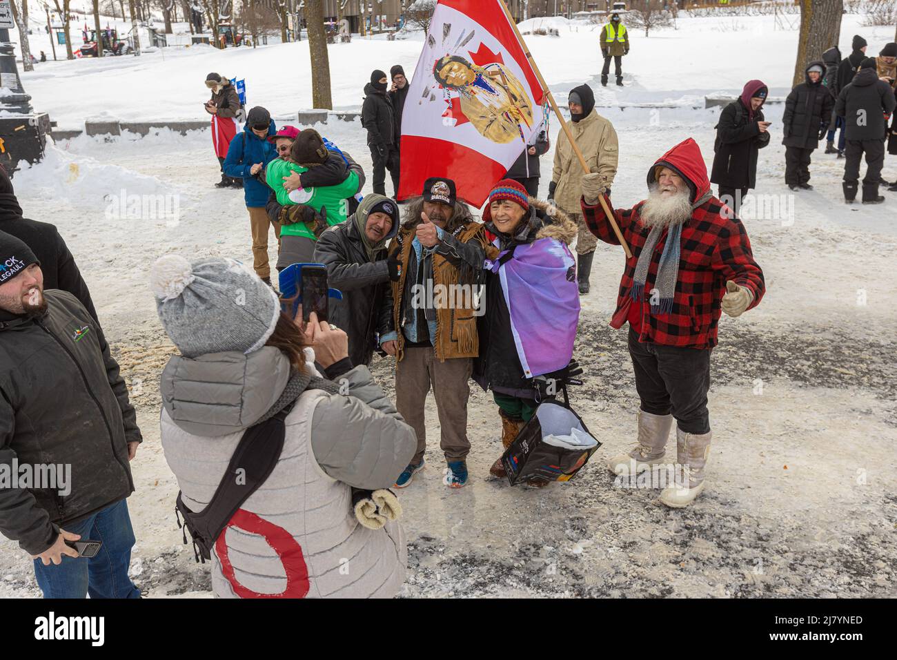 A group of people take photos at the "convoie de la liberte" (freedom ...