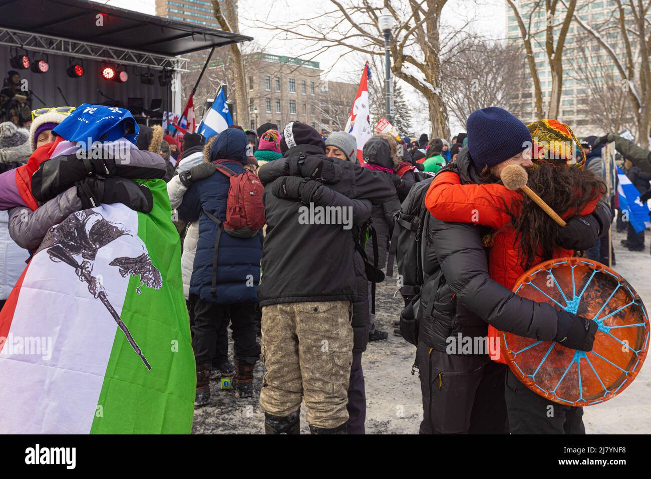 Protesters hug each others after a communal meditation during a protest ...