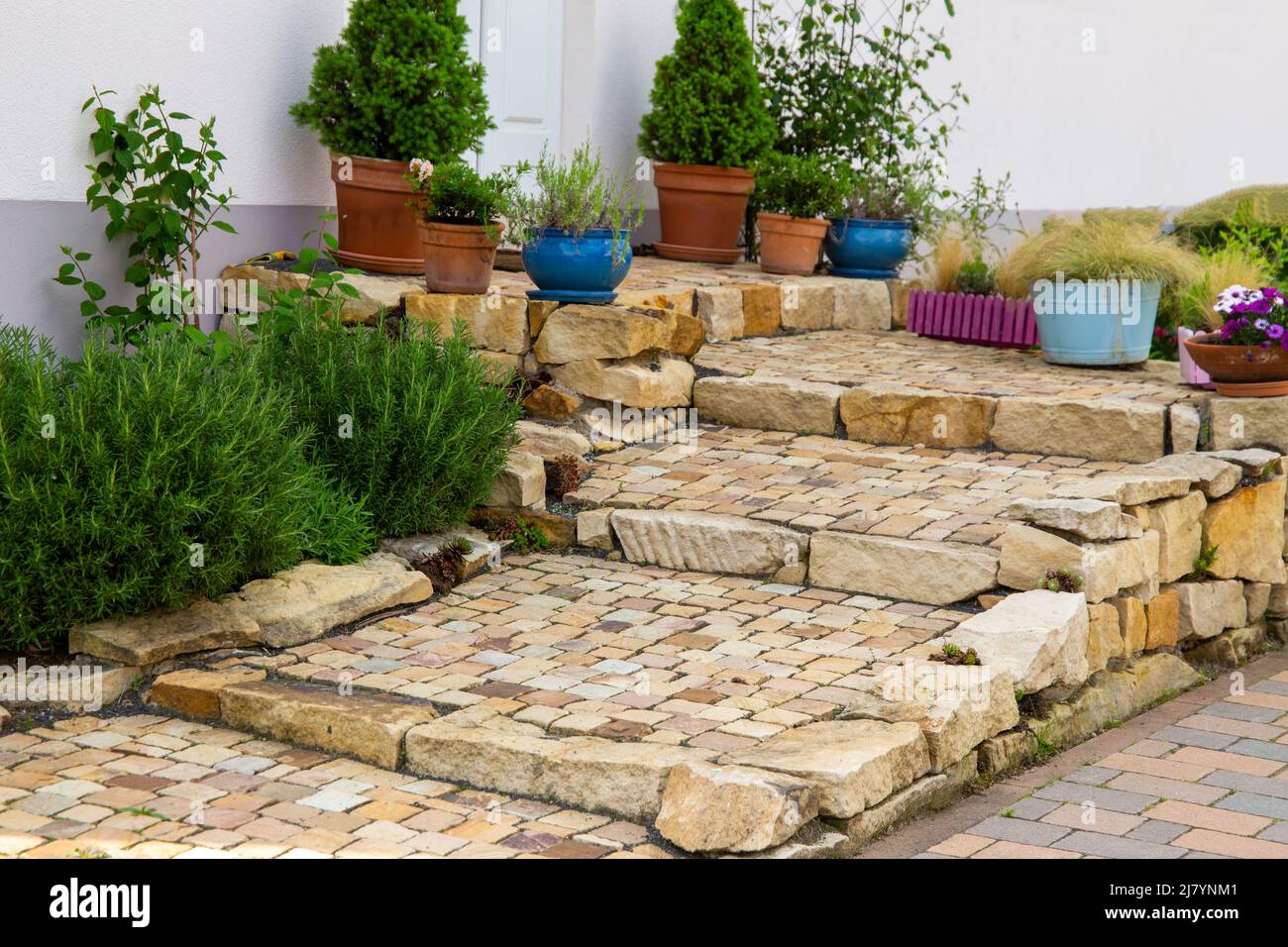 Beautiful natural stone stairs at the entrance of a residential house ...