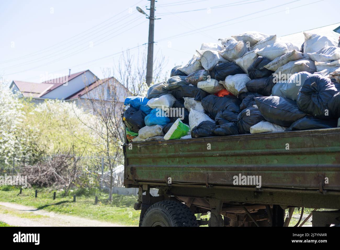Bags with garbage in the trailer, cleaning the territory Stock Photo ...