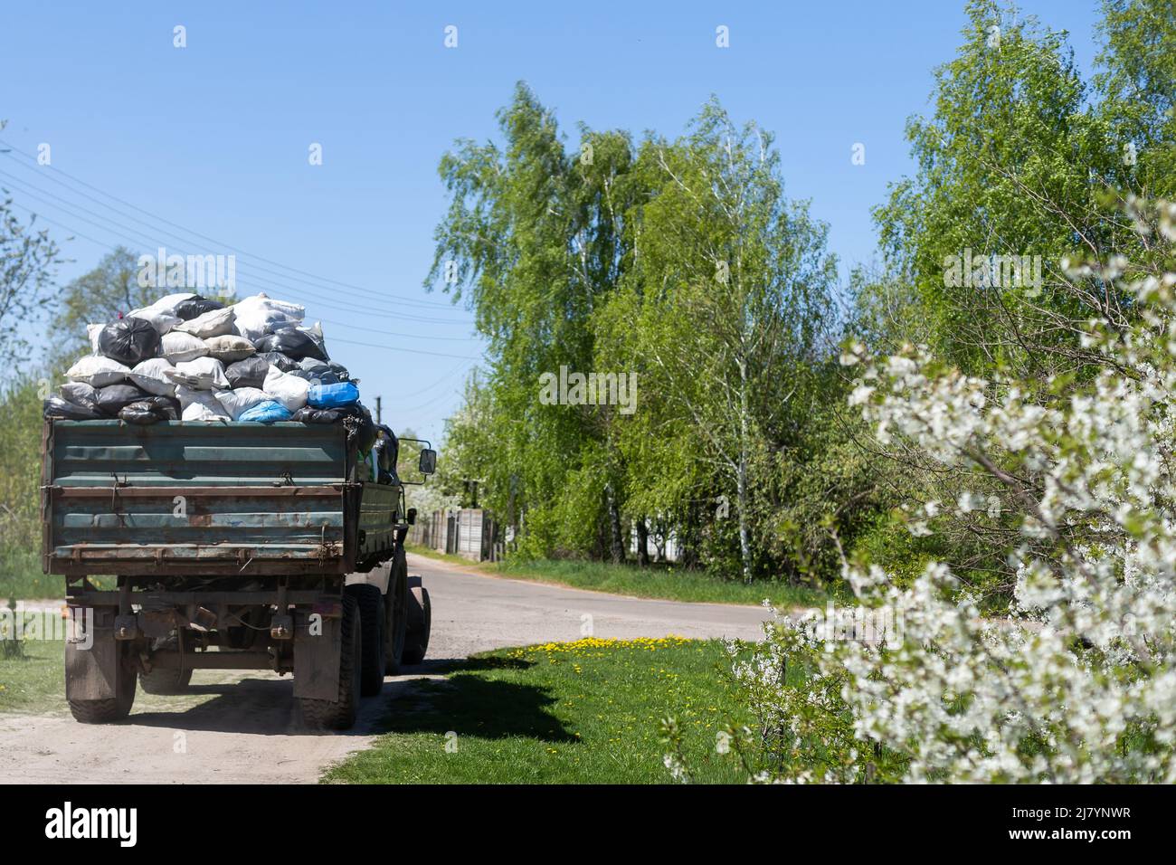 Bags with garbage in the trailer, cleaning the territory Stock Photo ...
