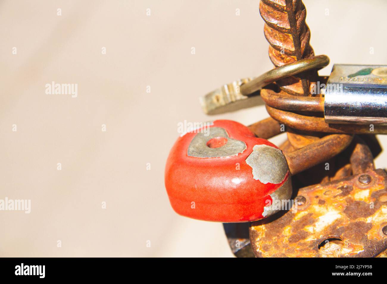 Old padlock. Door lock in the form of a heart. Closed door. The ...