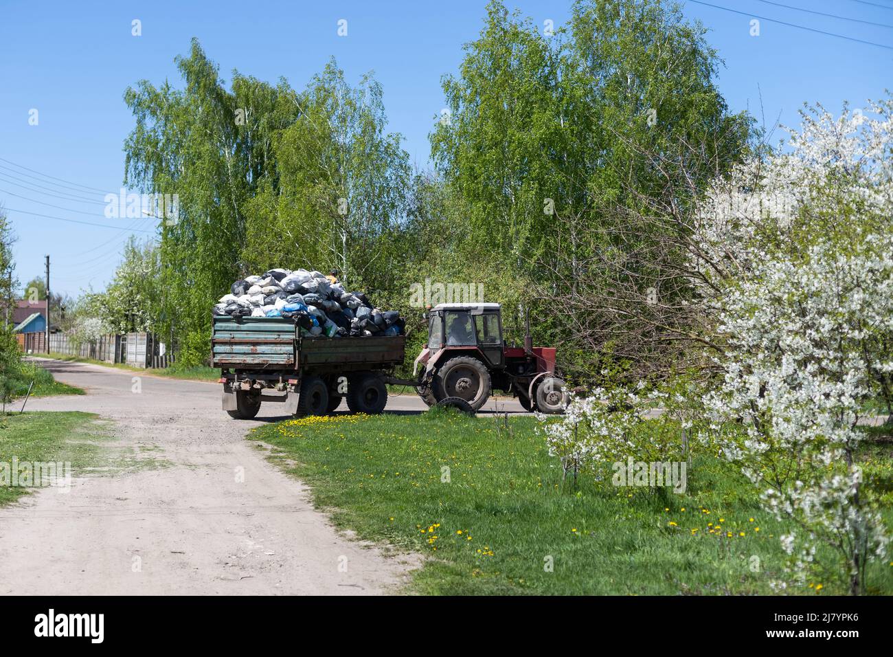 tractor trailer filled with garbage bags Stock Photo - Alamy