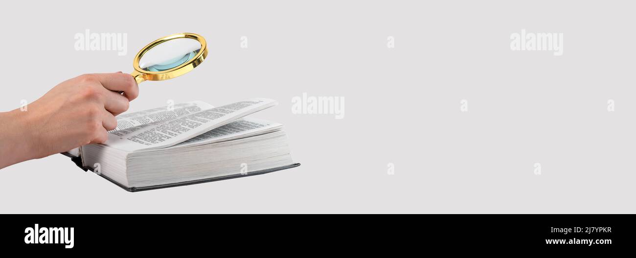 Man magnifying glass book hi-res stock photography and images - Alamy