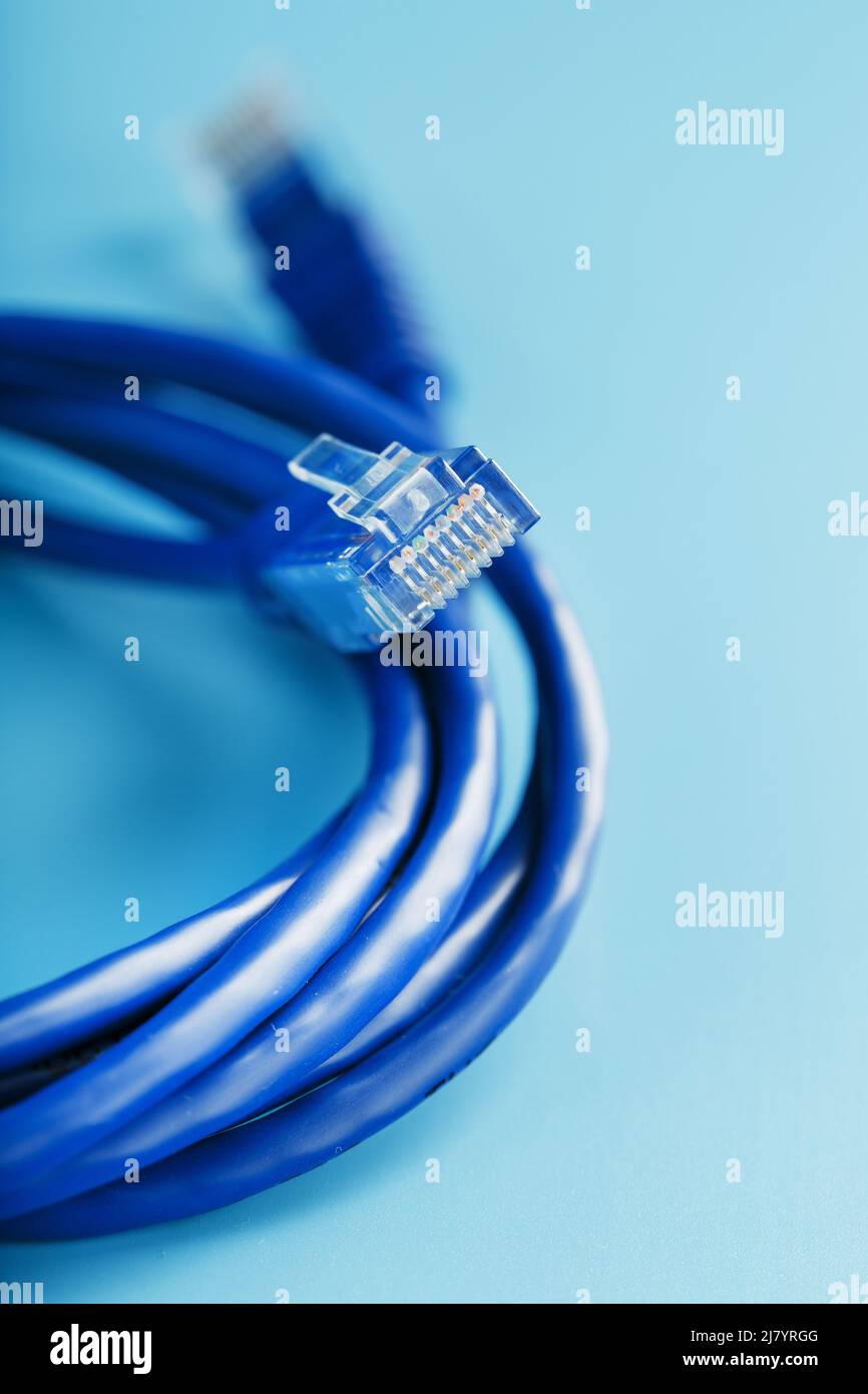 Blue UTP Internet Cable - Isolated on a blue background Ethernet Cord ...
