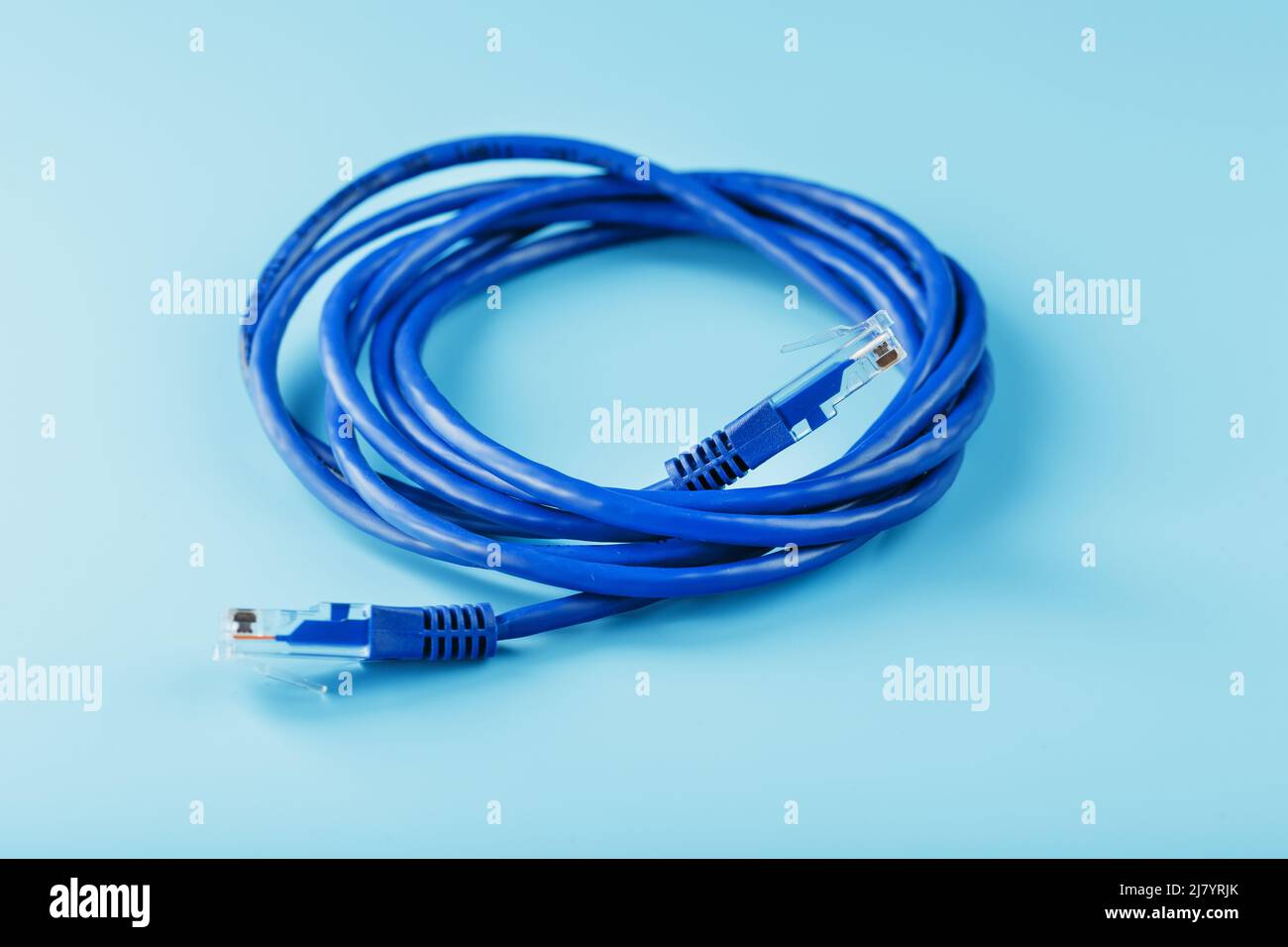 Blue UTP Internet Cable - Isolated on a blue background Ethernet Cord ...