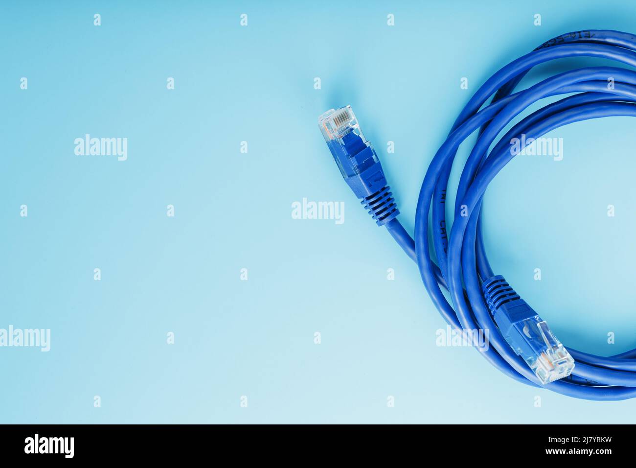 Blue UTP Internet Cable - Isolated on a blue background Ethernet Cord ...