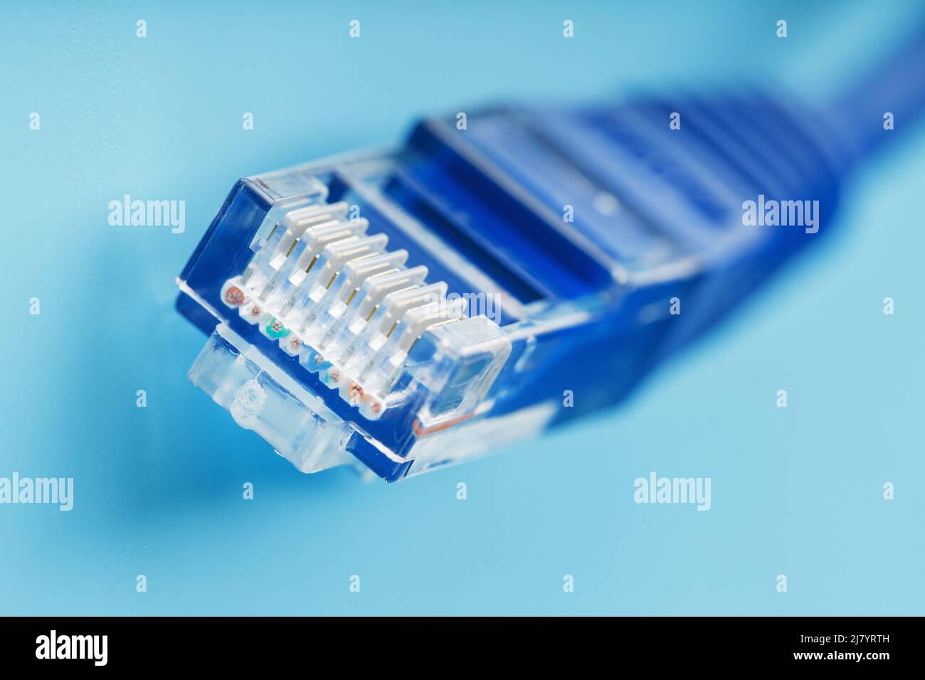 Blue UTP Internet Cable - Isolated on a blue background Ethernet Cord ...
