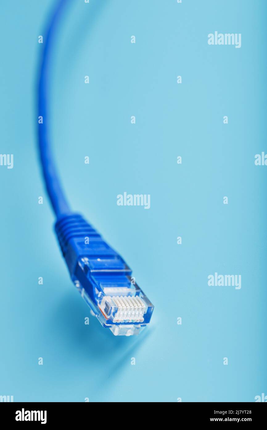 Blue UTP Internet Cable - Isolated on a blue background Ethernet Cord ...