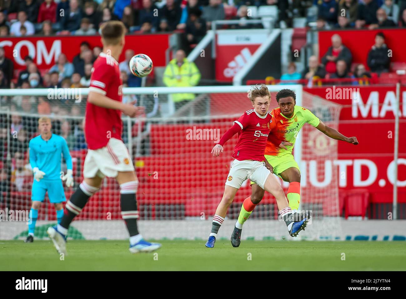 Pharrell Johnson #5 of Nottingham Forest clears from Alejandro Garnacho ...