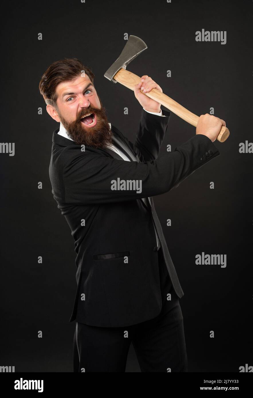 Aggressive bearded man in suit threaten with axe dark background, rage ...