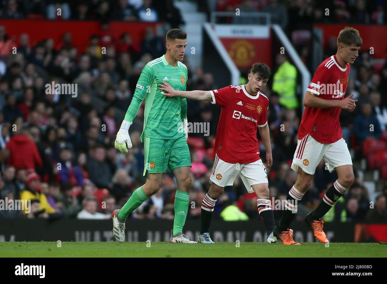 Radek Vitek #1 of Manchester United is consoled by a team mate after ...