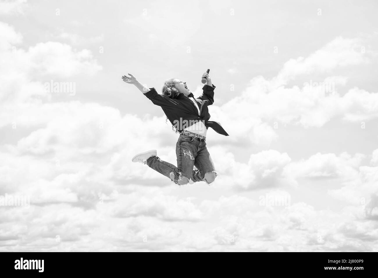cheerful child fly high in the sky, full of energy Stock Photo - Alamy