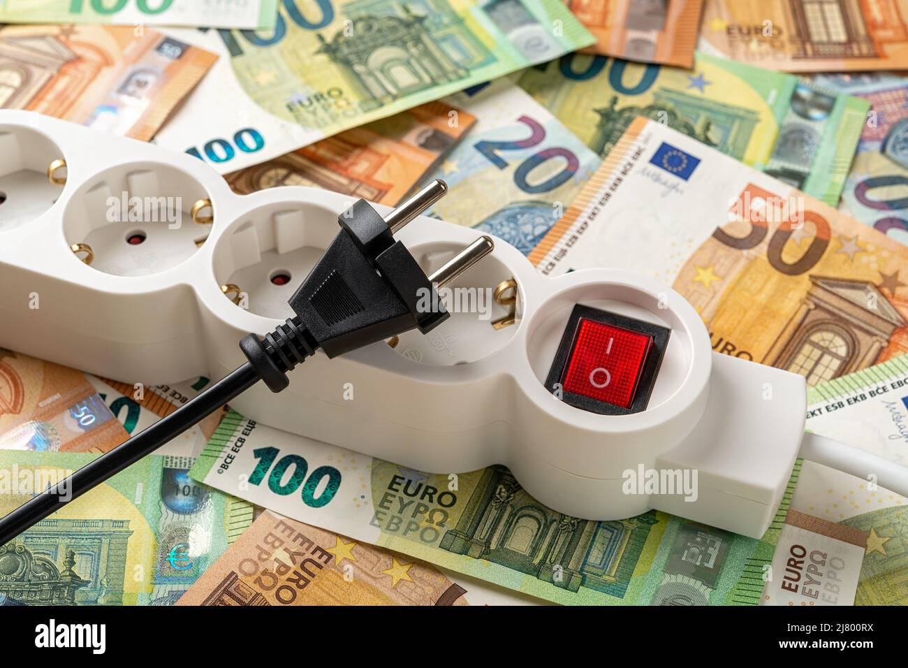 Switched off white power strip and unplugged black electric plug over ...