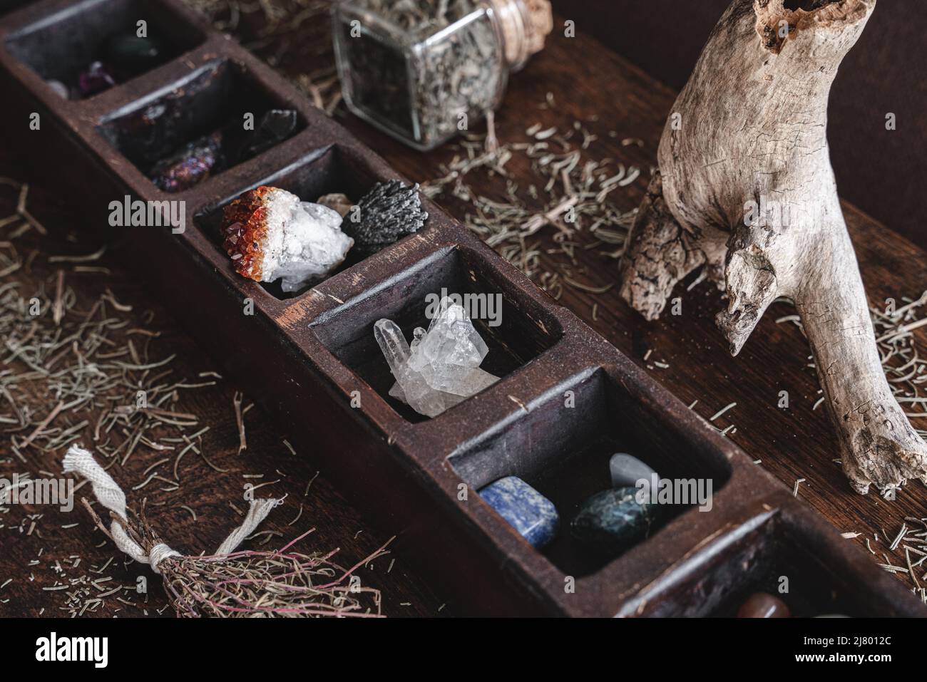 A collection of various different crystals on a messy wiccan witch's ...