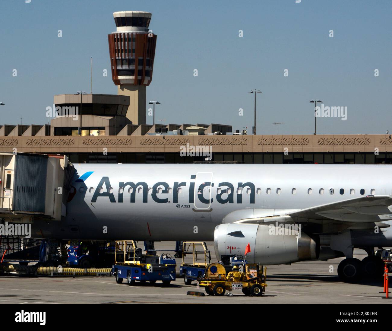 An American Airlines Airbus A320 passenger plane is serviced at a gate ...