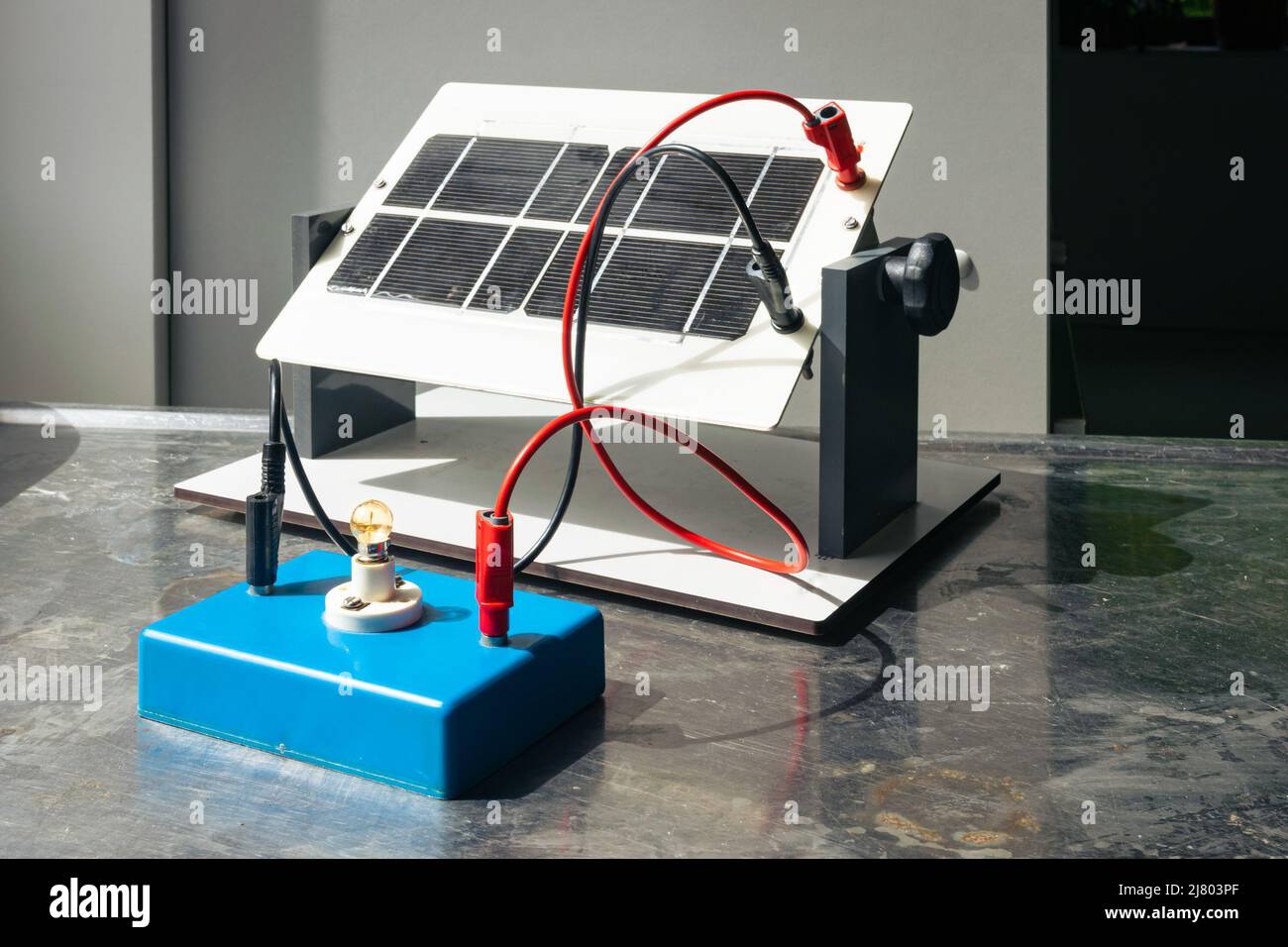 Solar panel to which a small light bulb is connected. Used as a ...