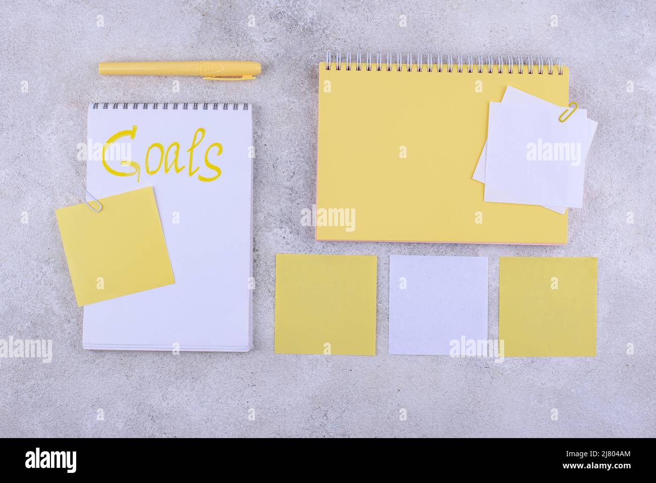 Target and goal concept with arrows and notebook Stock Photo - Alamy