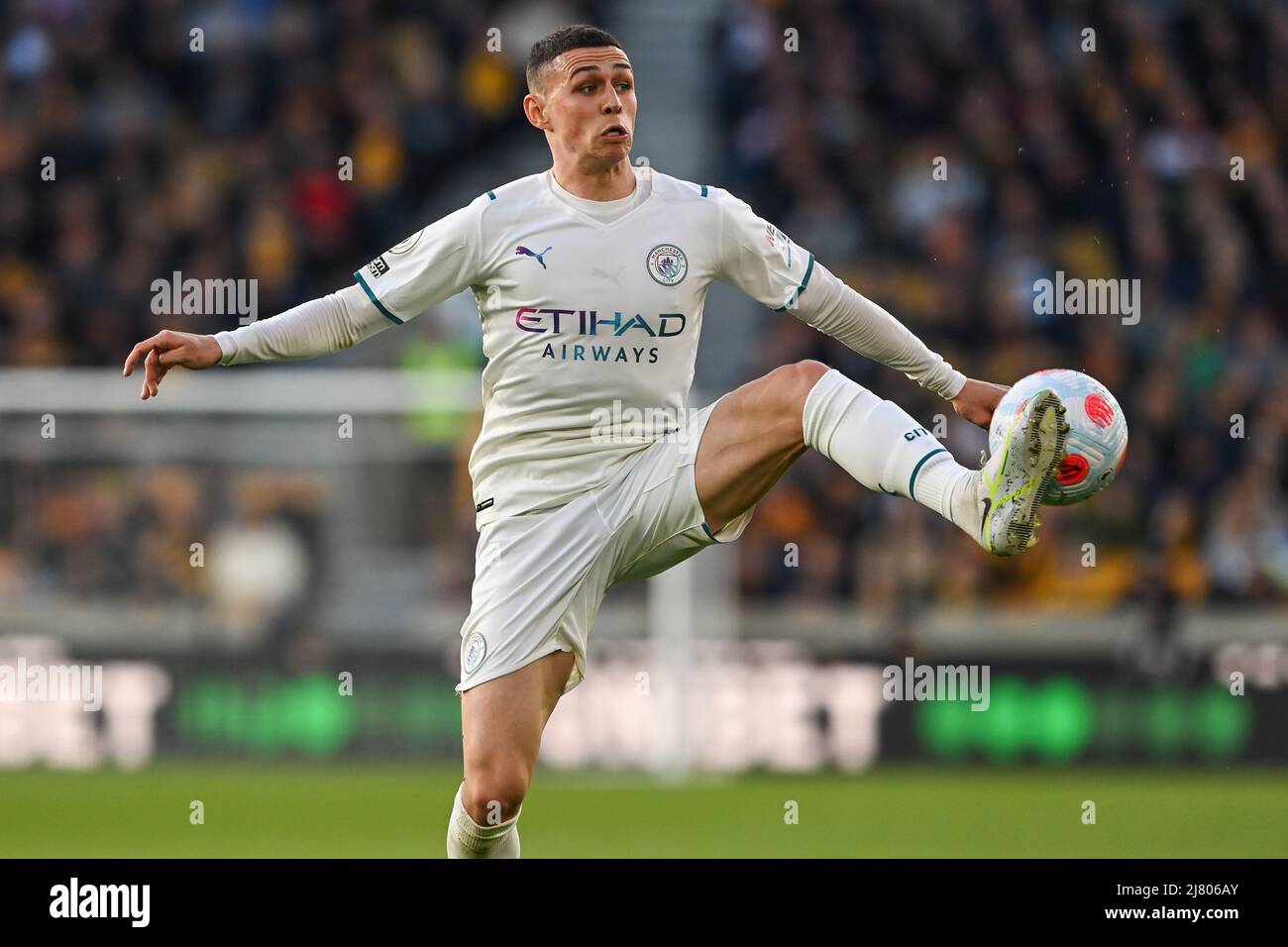 Phil Foden #47 of Manchester City tries to control the ball Stock Photo ...