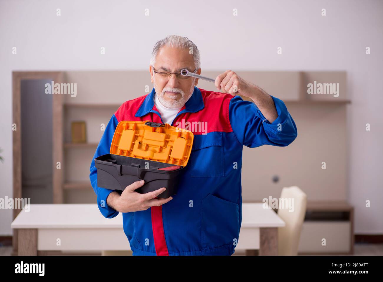 Old carpenter working at home Stock Photo - Alamy