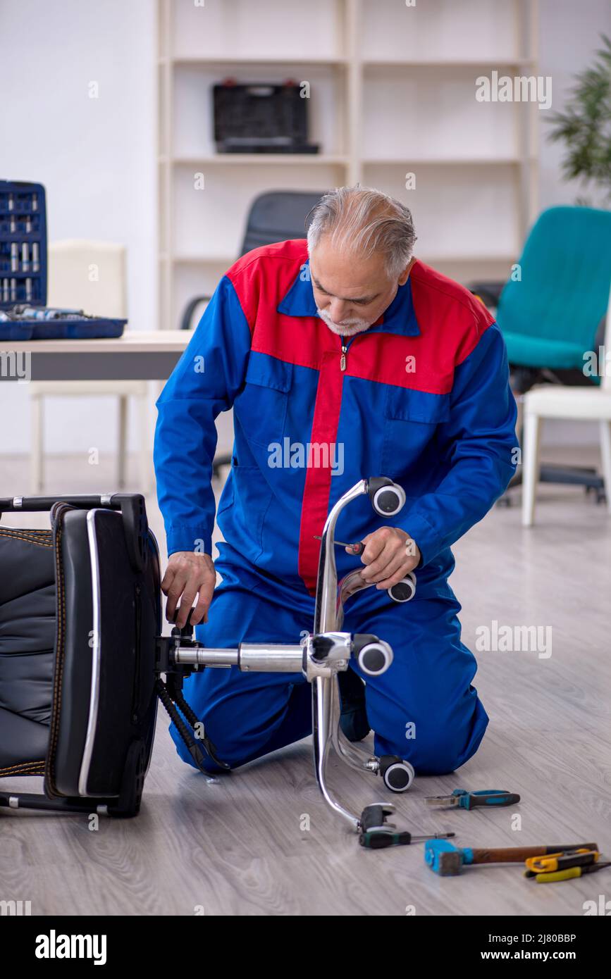 Male repairman repairing office chair hi-res stock photography and ...