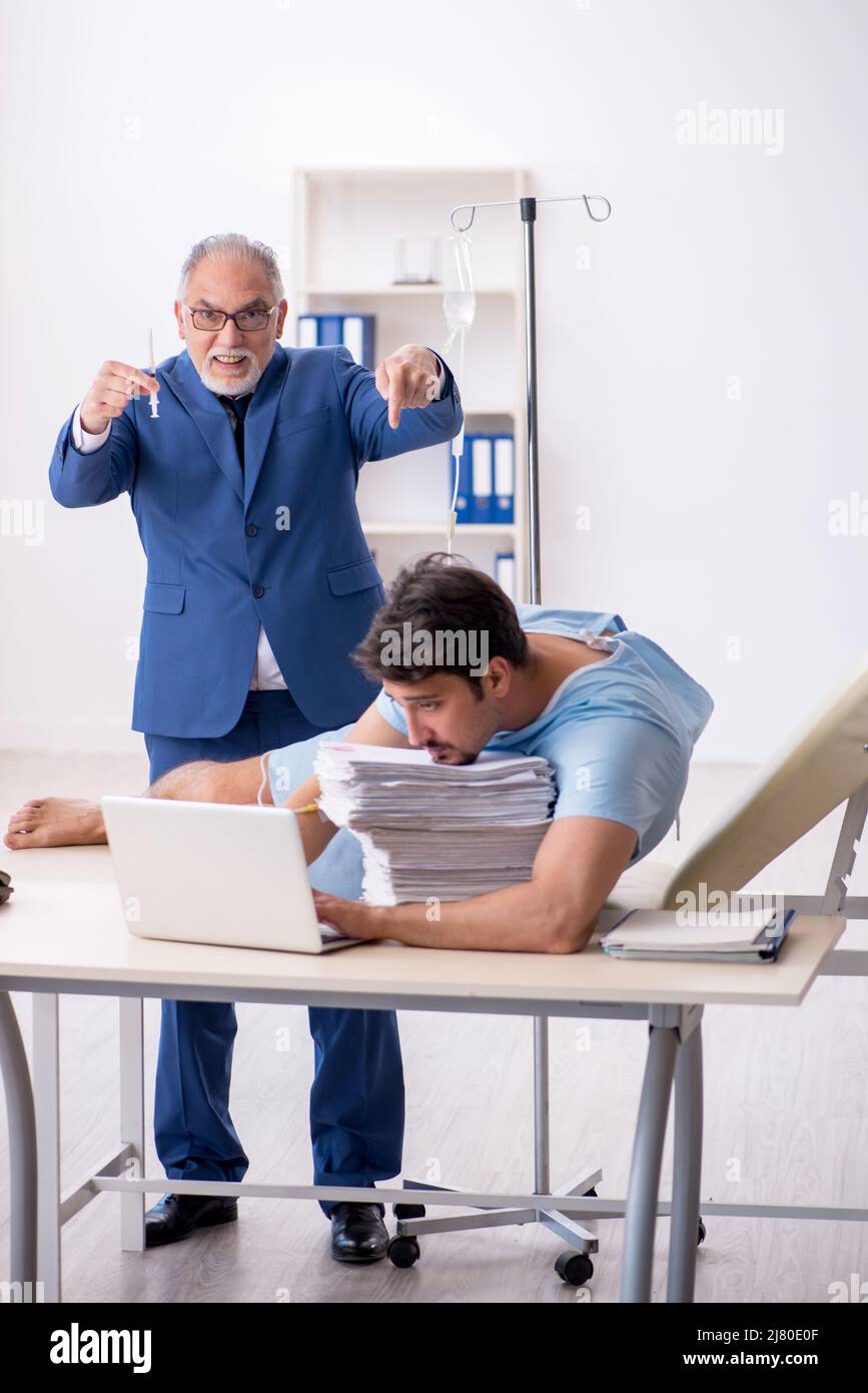 Young employee feeling bad at workplace Stock Photo - Alamy