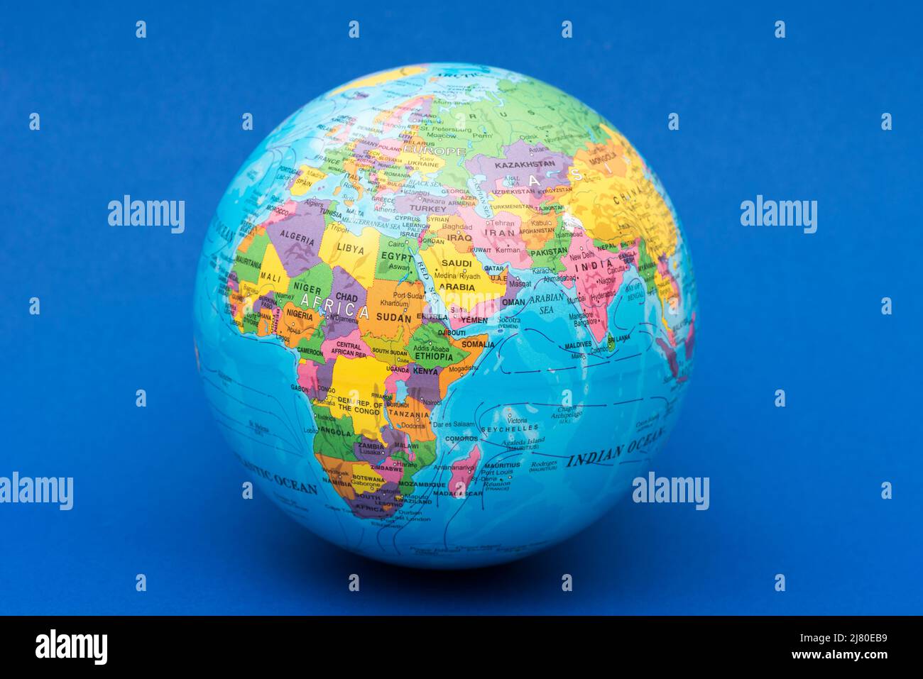 World globe ball on blue background Stock Photo - Alamy