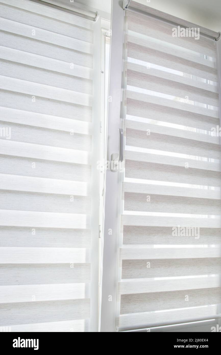 Window roller duo system day and night. Close up on roll curtains ...