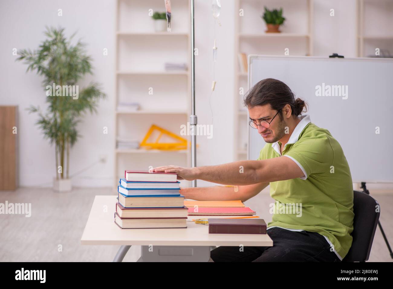 Young sick teacher student in blood transfusion concept Stock Photo - Alamy