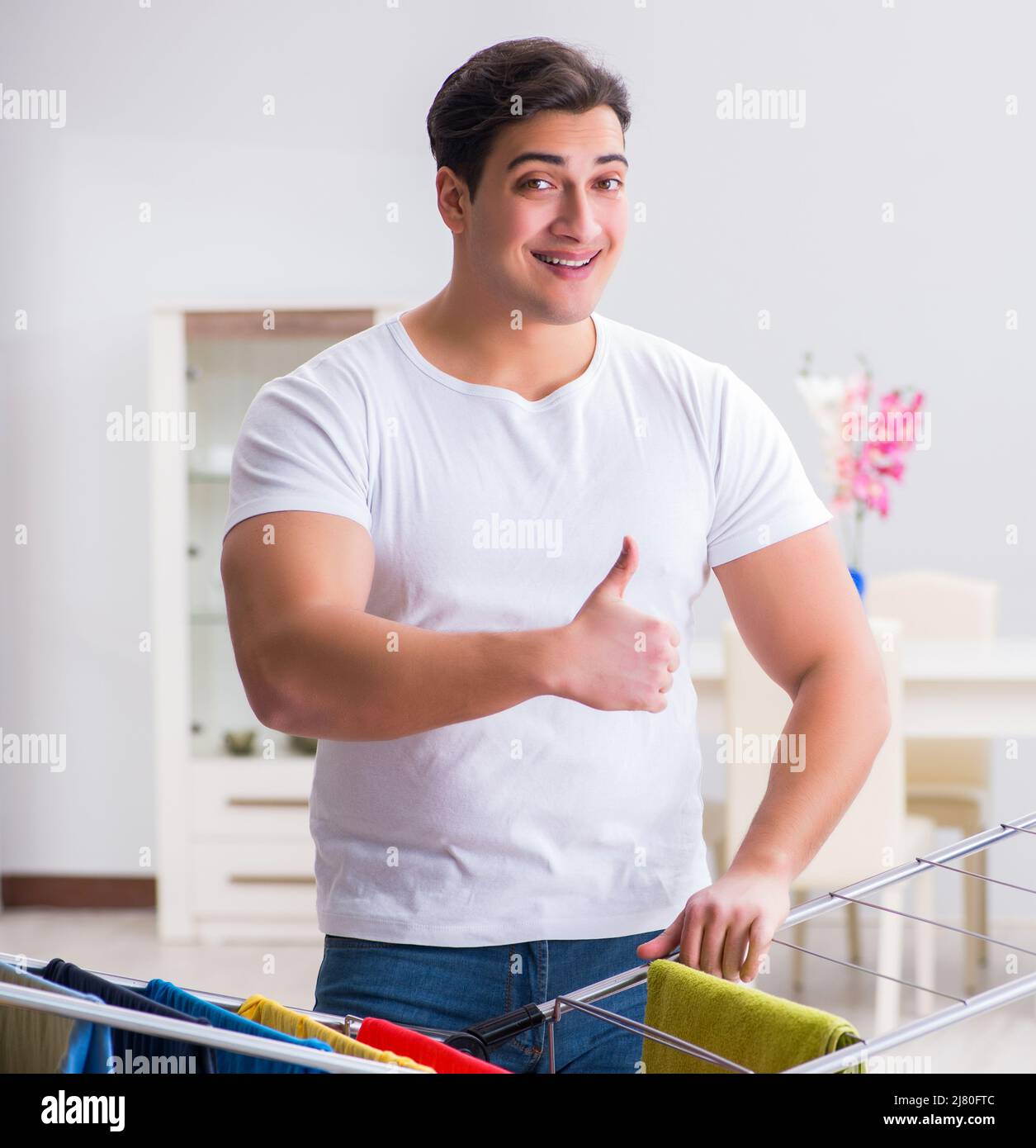Folding clothes laundry male hi-res stock photography and images - Alamy