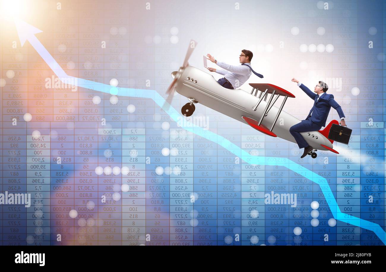 The businessman flying on vintage old airplane Stock Photo - Alamy