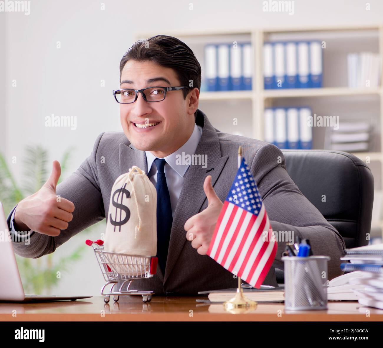 The businessman with american flag in office Stock Photo - Alamy
