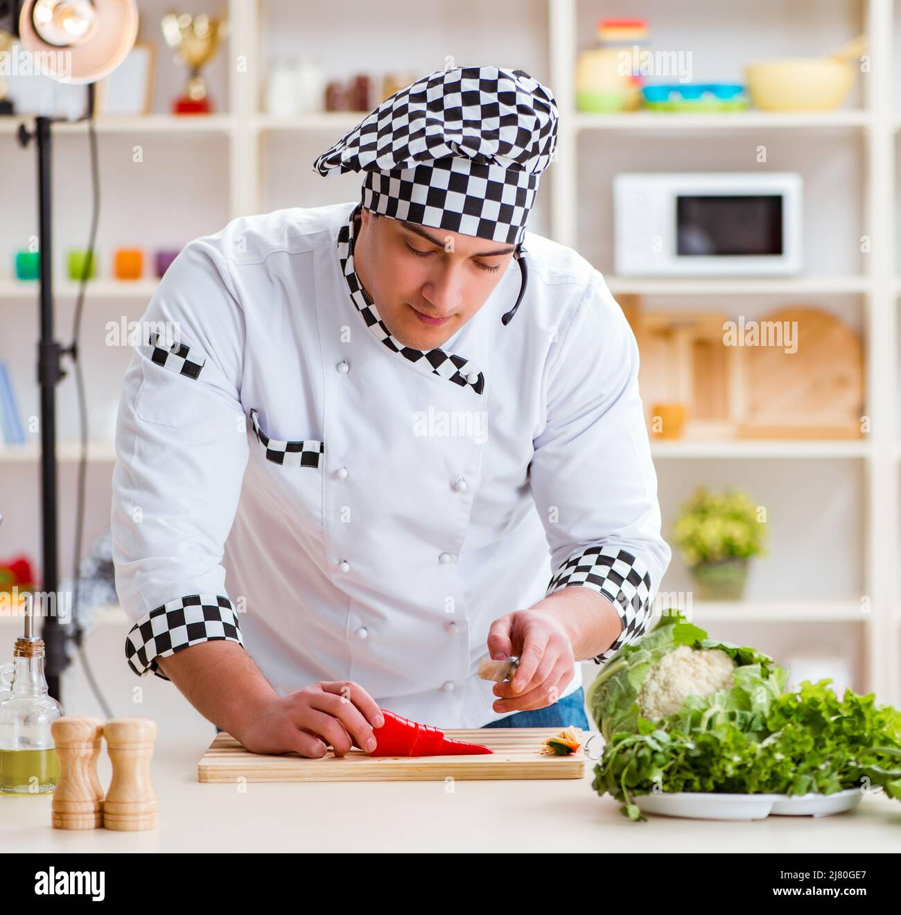Professional cook filming cooking show hi-res stock photography and ...