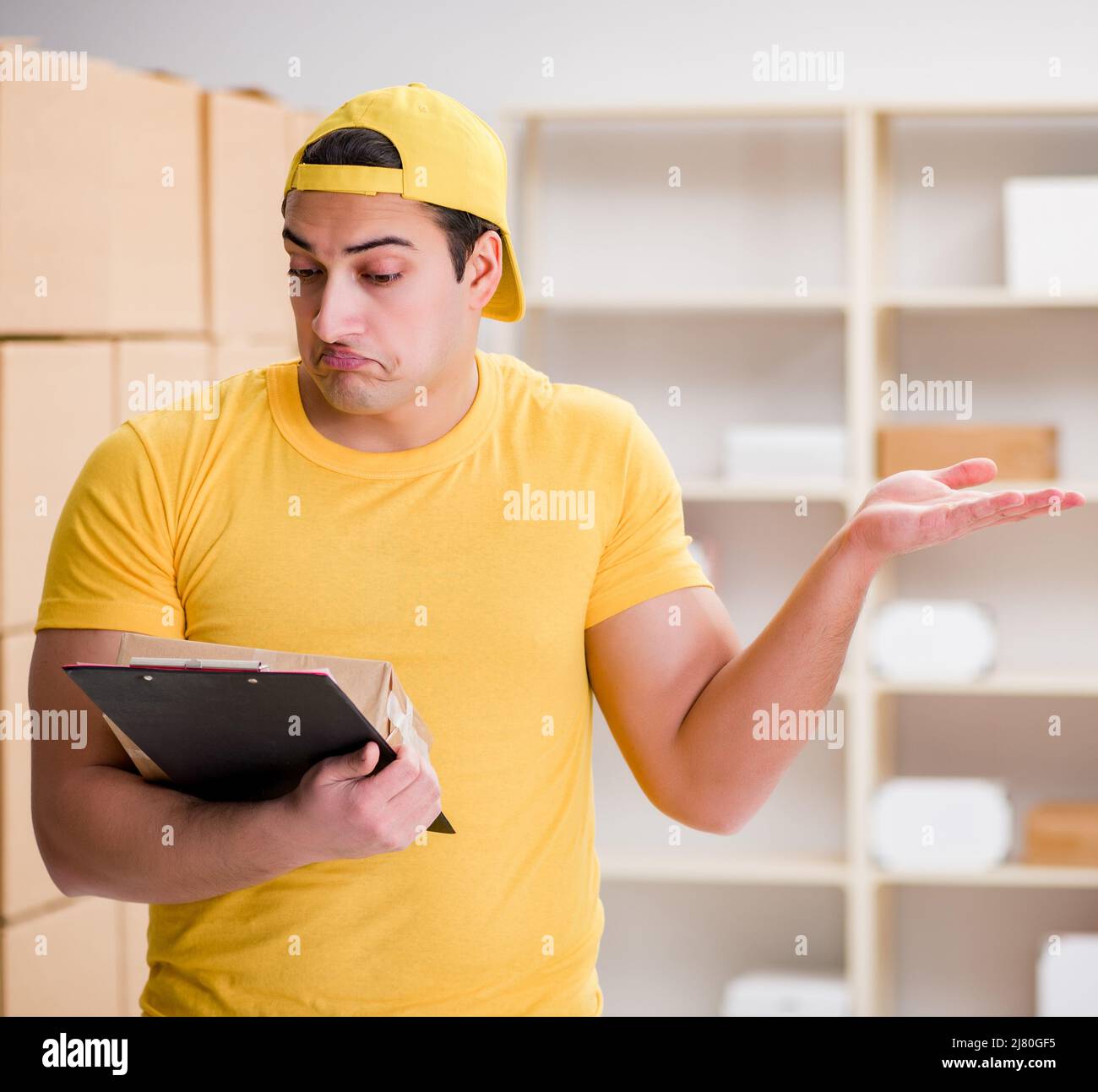 The man working in postal parcel delivery service office Stock Photo ...