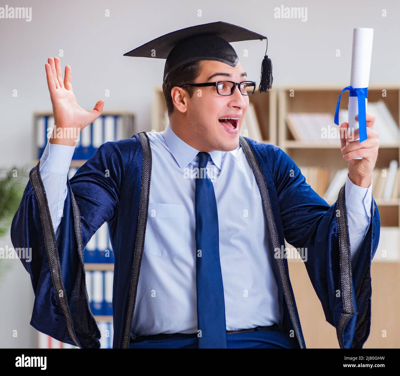 The young man graduating from university Stock Photo - Alamy