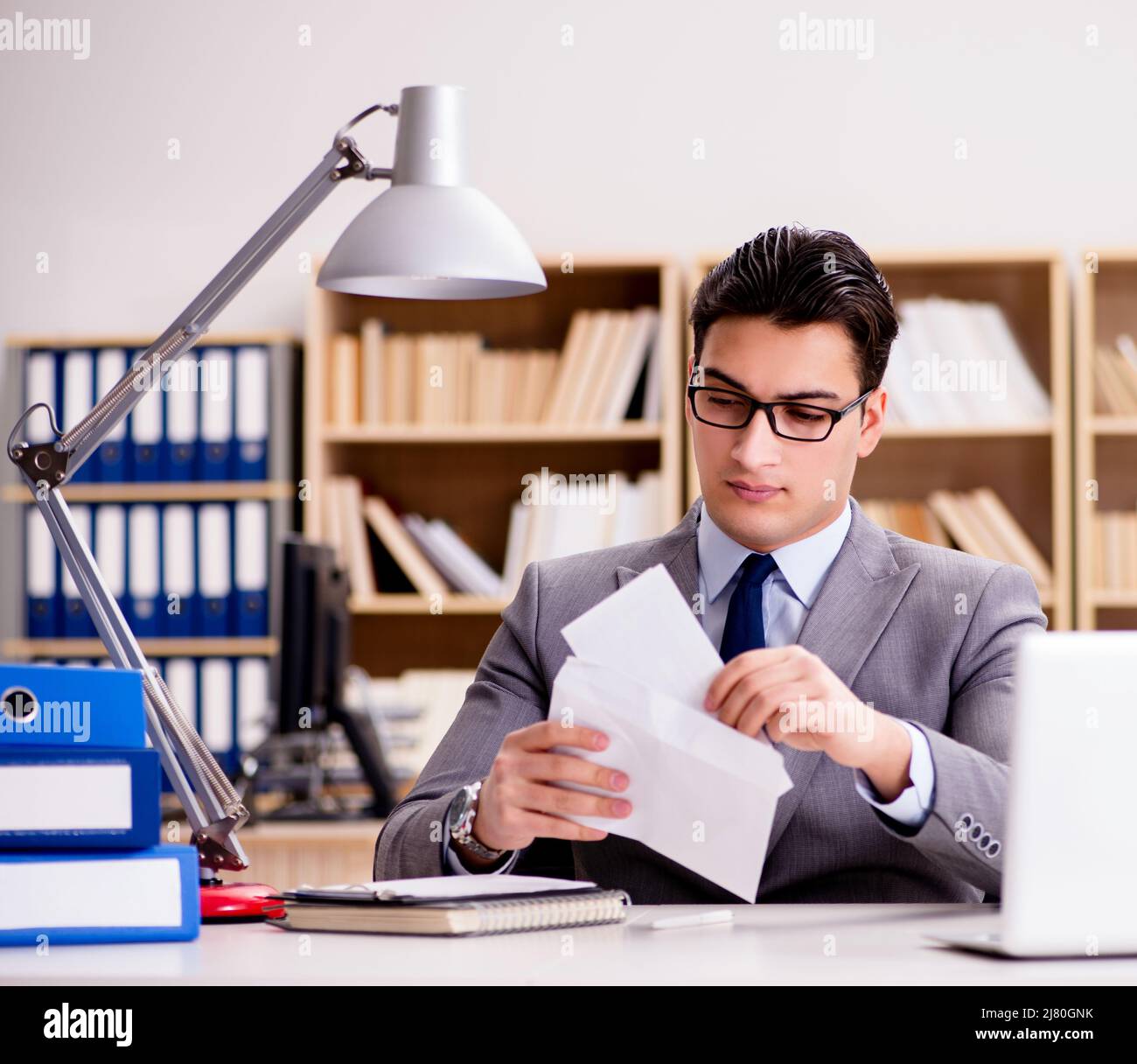 The businessman receiving letter envelope in office Stock Photo - Alamy
