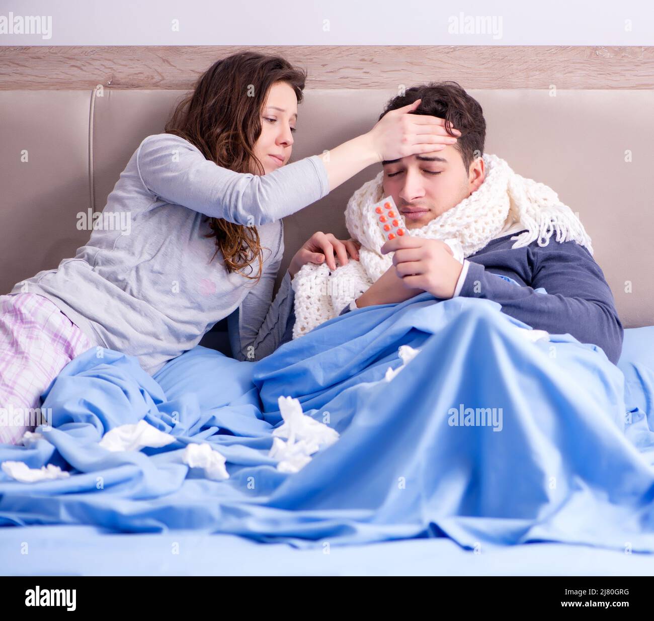 The wife caring for sick husband at home in bed Stock Photo - Alamy