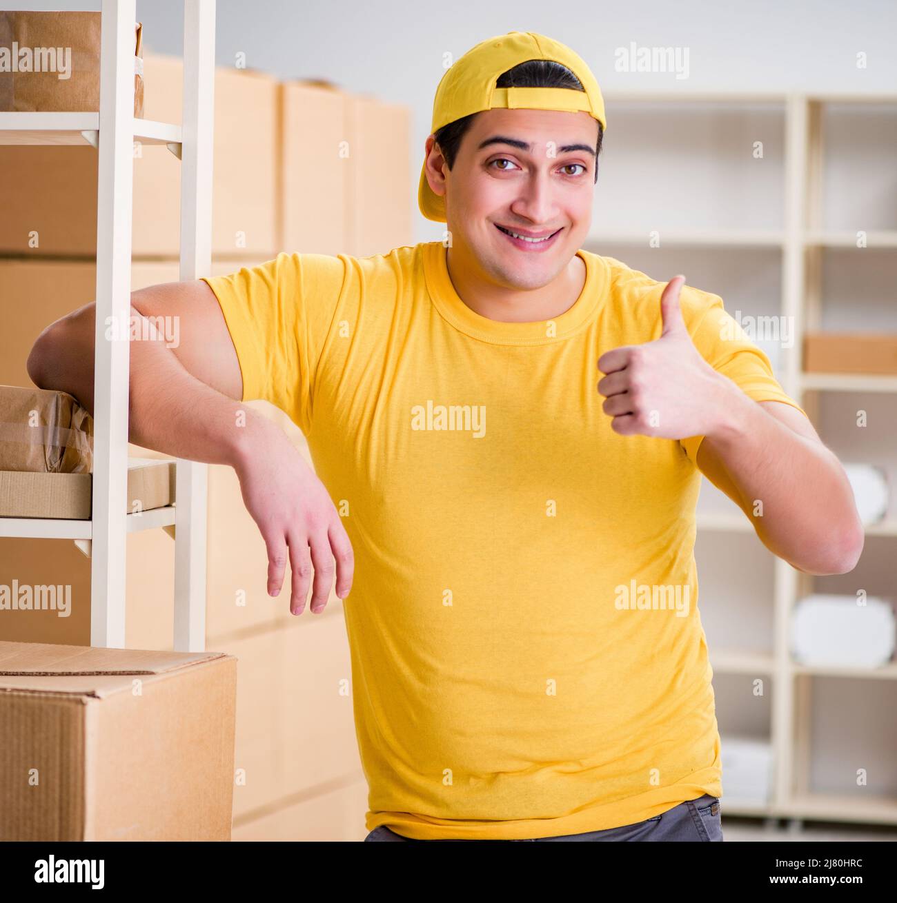 The man working in postal parcel delivery service office Stock Photo ...
