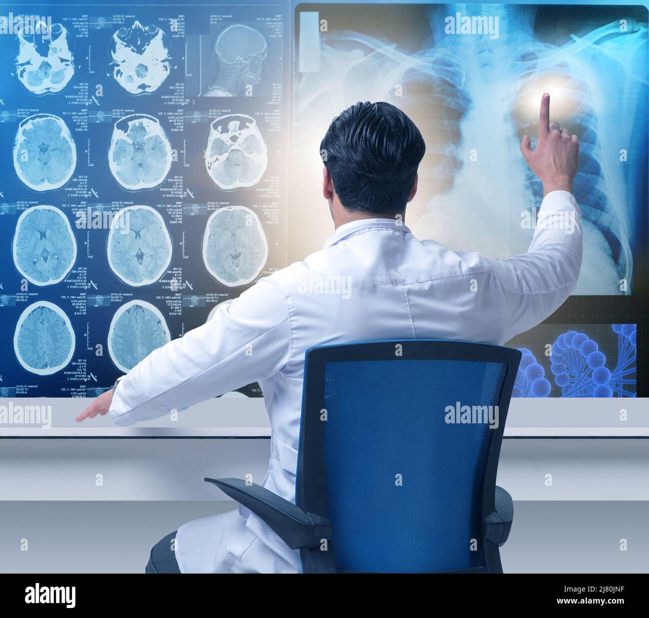 The male doctor looking at mri scans Stock Photo - Alamy