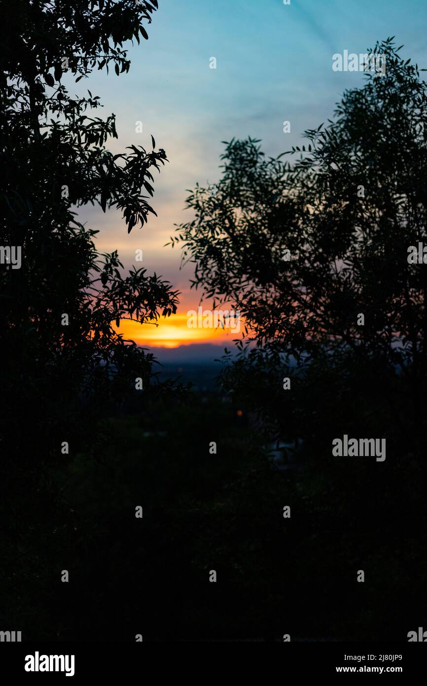 Sunset. Sunset with high clouds leaving the sky orange and blue ...