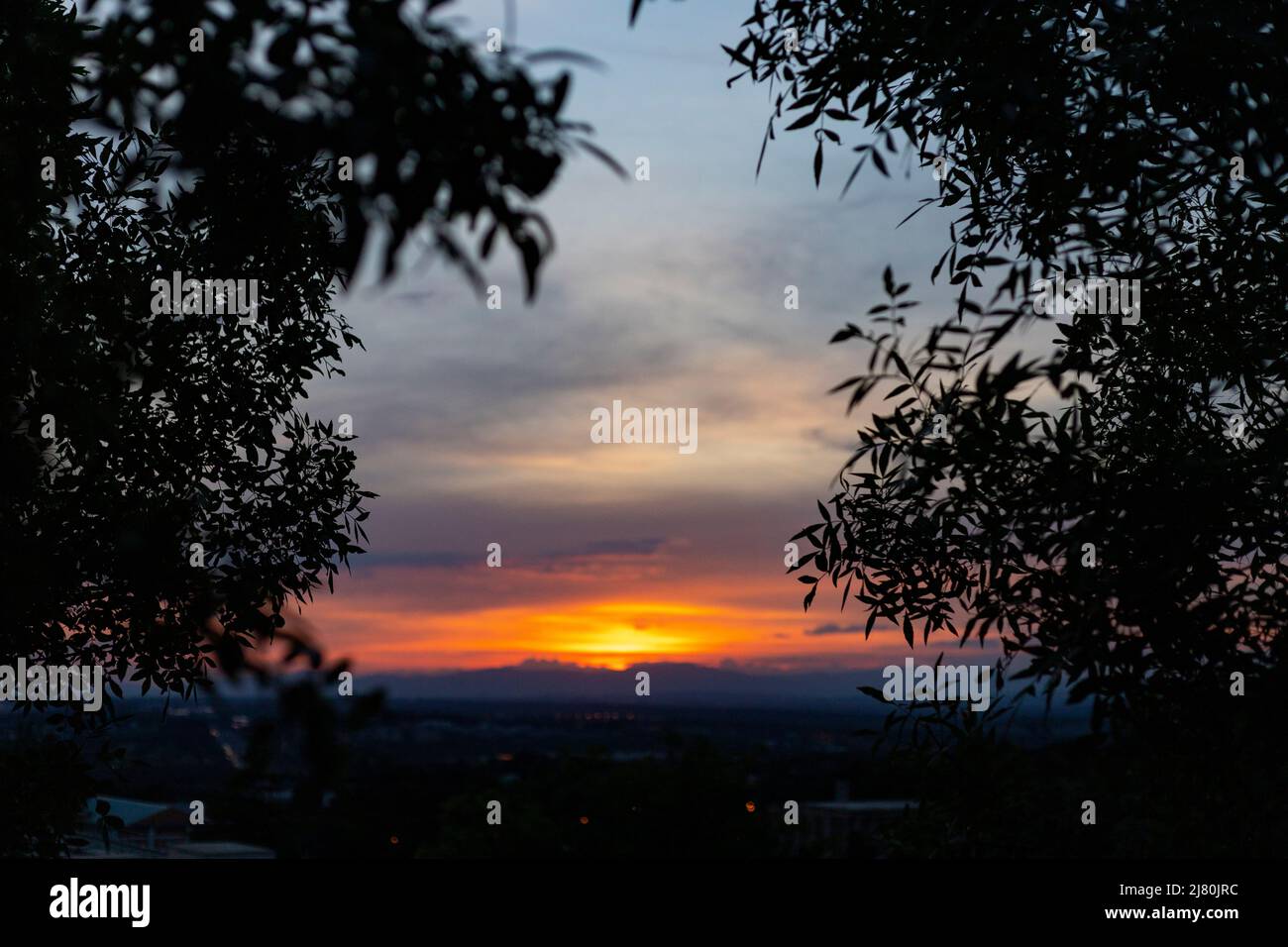 Sunset. Sunset with high clouds leaving the sky orange and blue ...