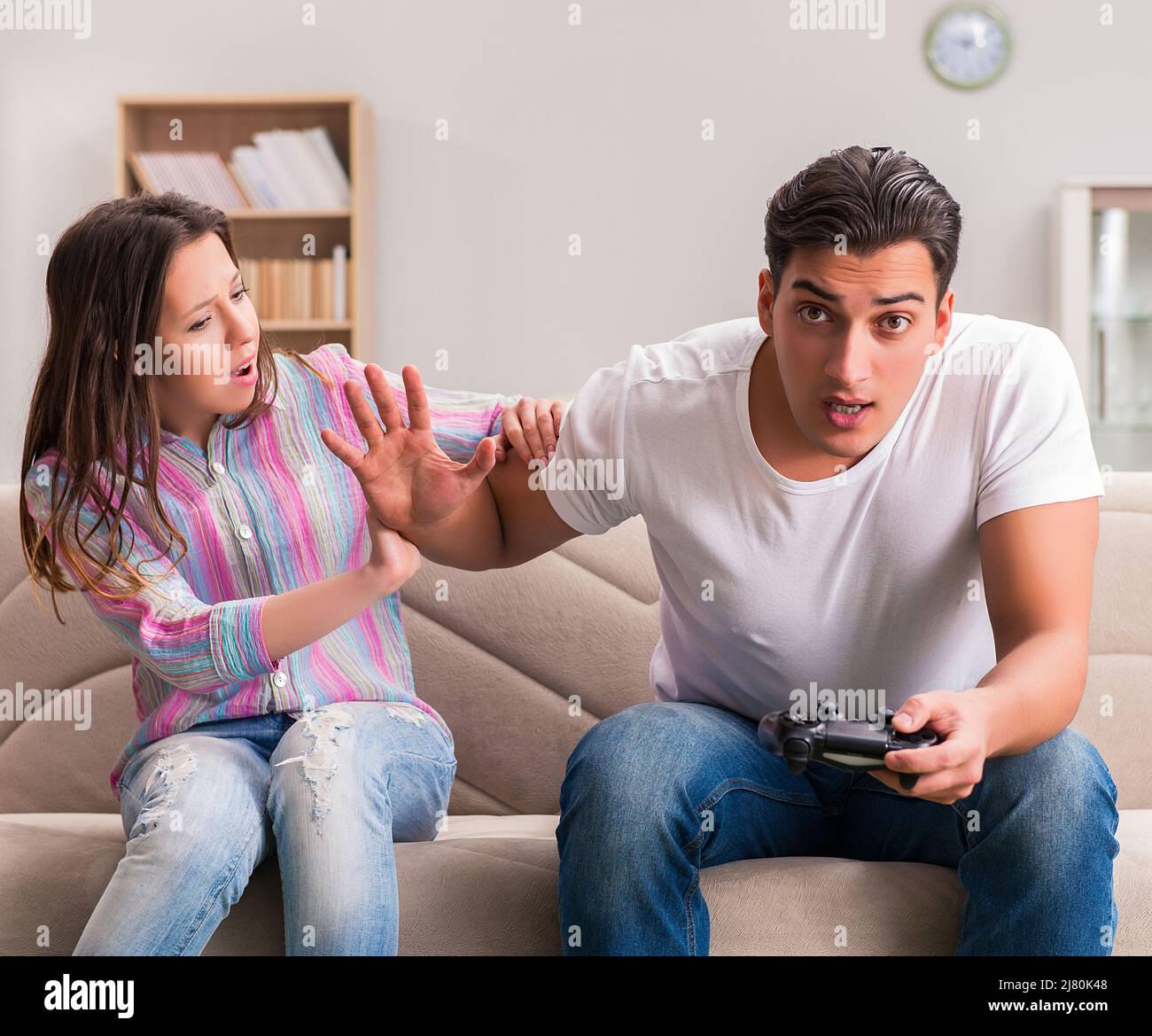 The young family suffering from computer games addiction Stock Photo ...