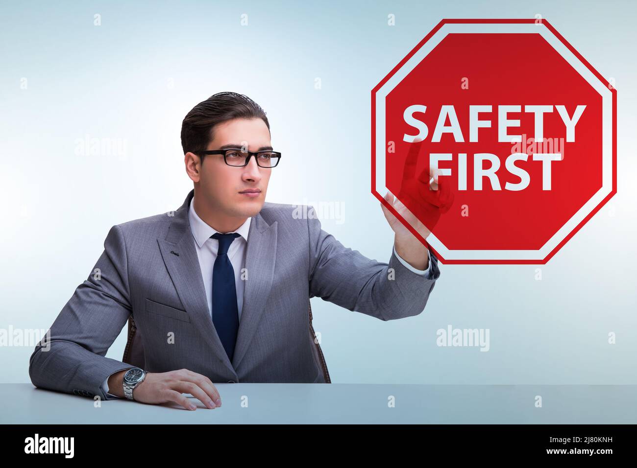 Safety first concept with the businessman Stock Photo - Alamy
