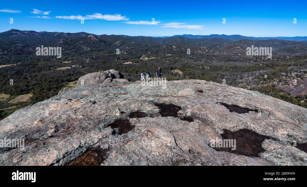 Three seniors hiking on The Pyramid, Girraween National Park ...