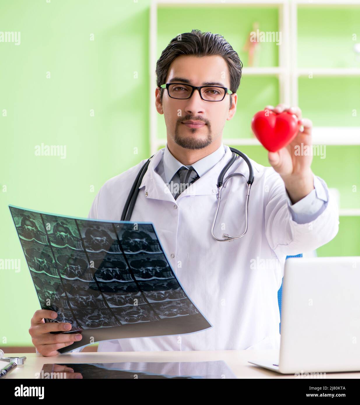 The doctor radiologist looking at x-ray scan in hospital Stock Photo ...