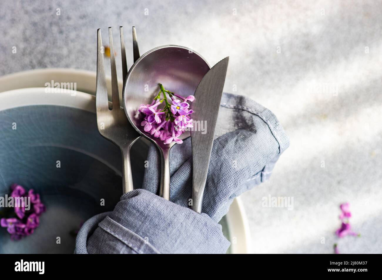 Overhead view of a spring place setting with lilac flower blossom Stock ...