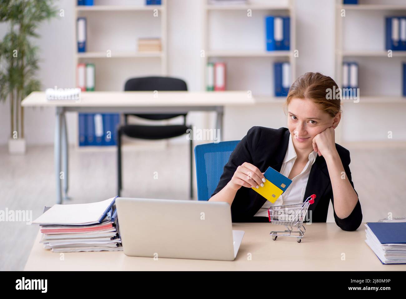 Female employee in e-commerce concept Stock Photo - Alamy